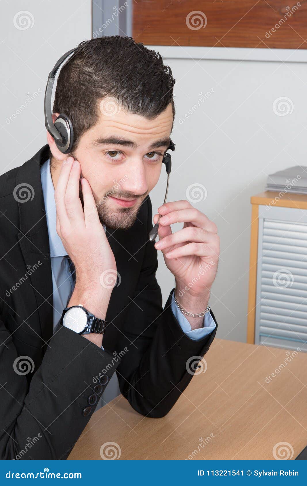 Man Working at a Computer in a Call Centre Agent Speaking with Costumer ...