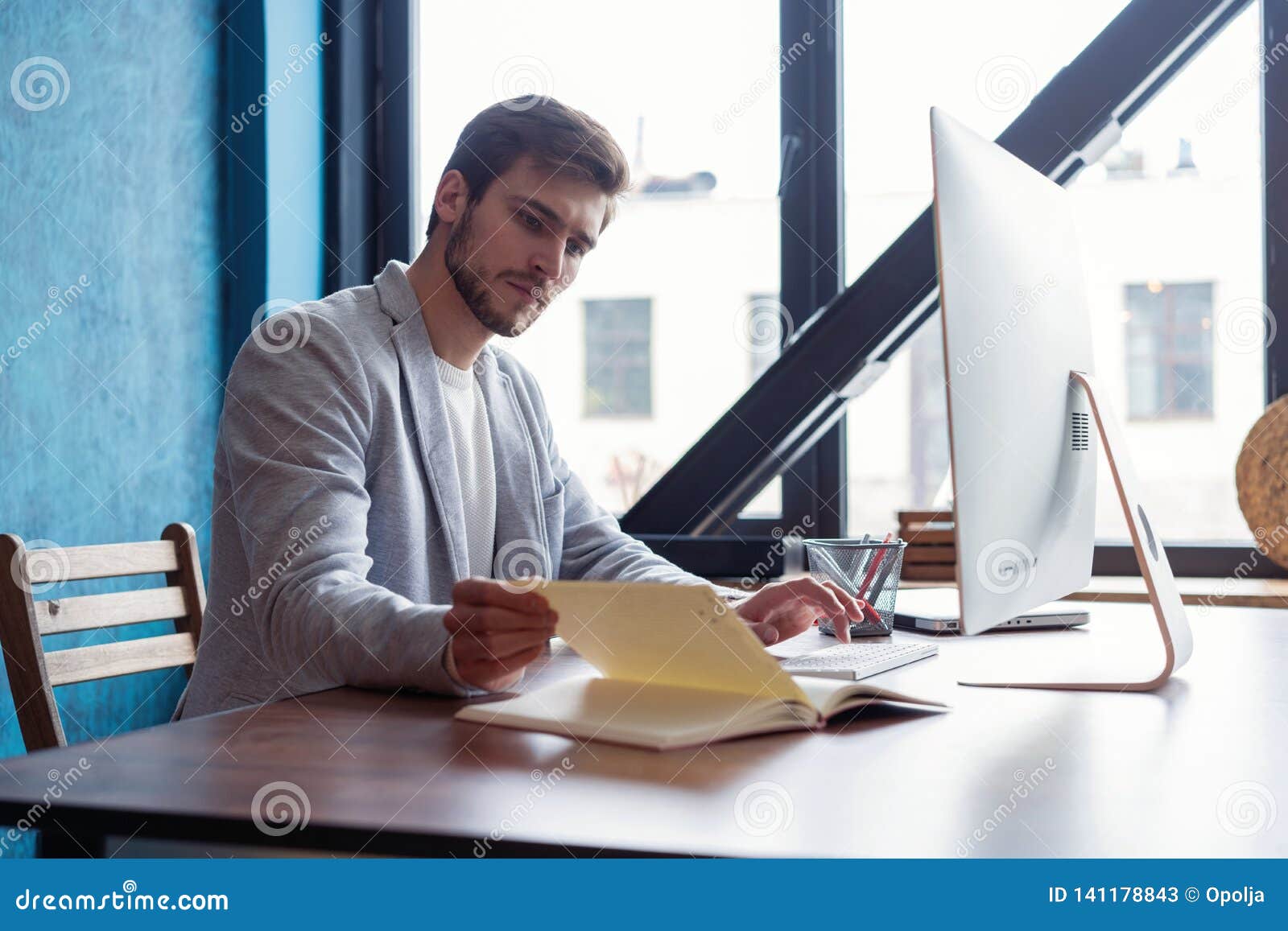 Man Working at Computer in Contemporary Office. Stock Image - Image of ...
