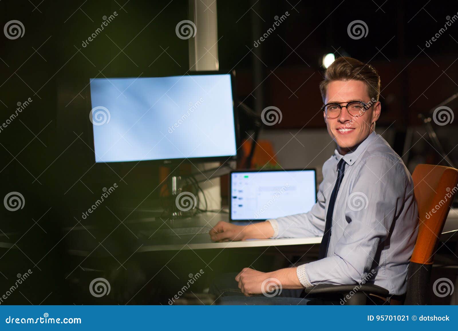Man Working on Computer in Dark Office Stock Image - Image of ...