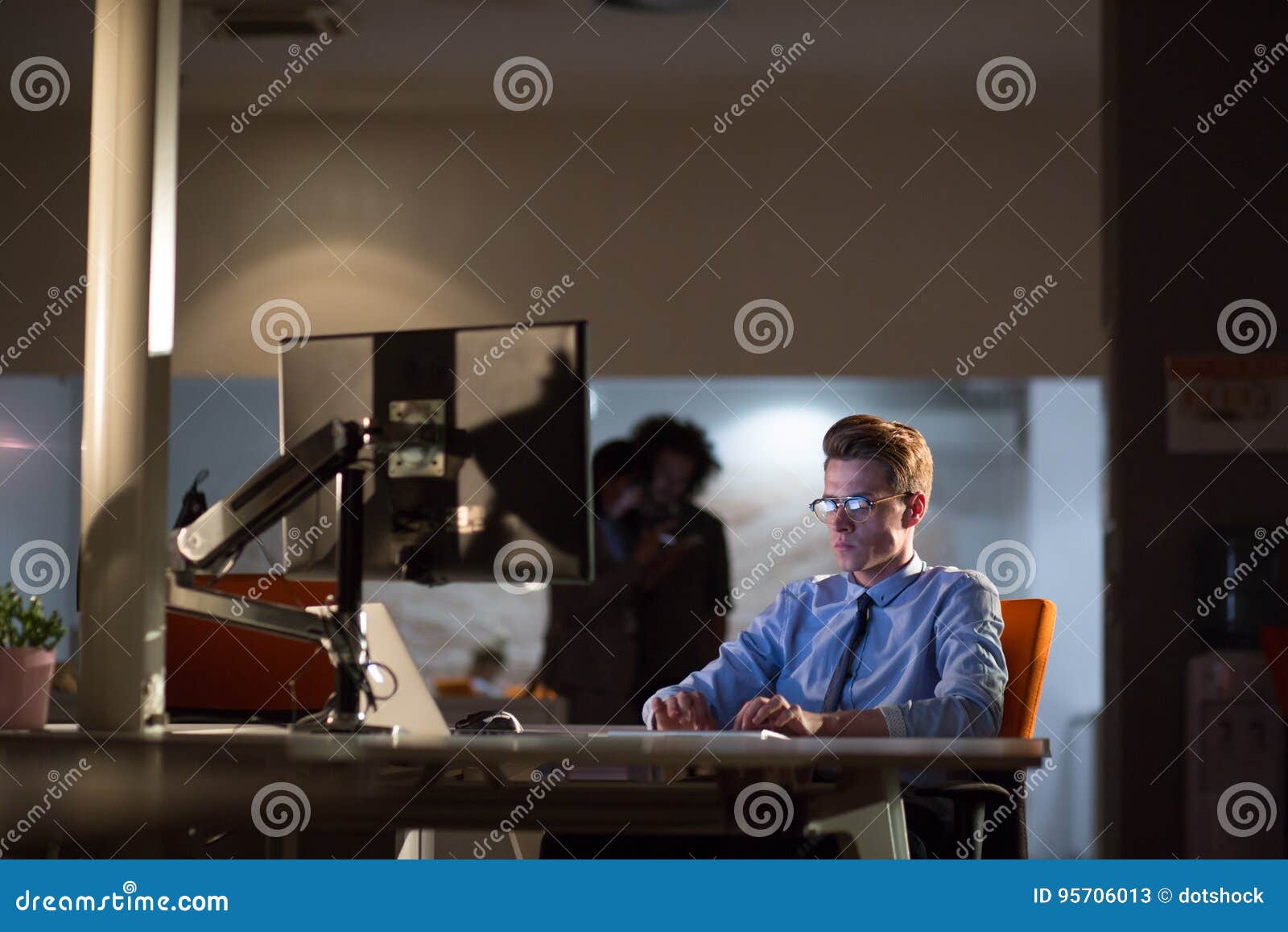 Man Working on Computer in Dark Office Stock Image - Image of people ...