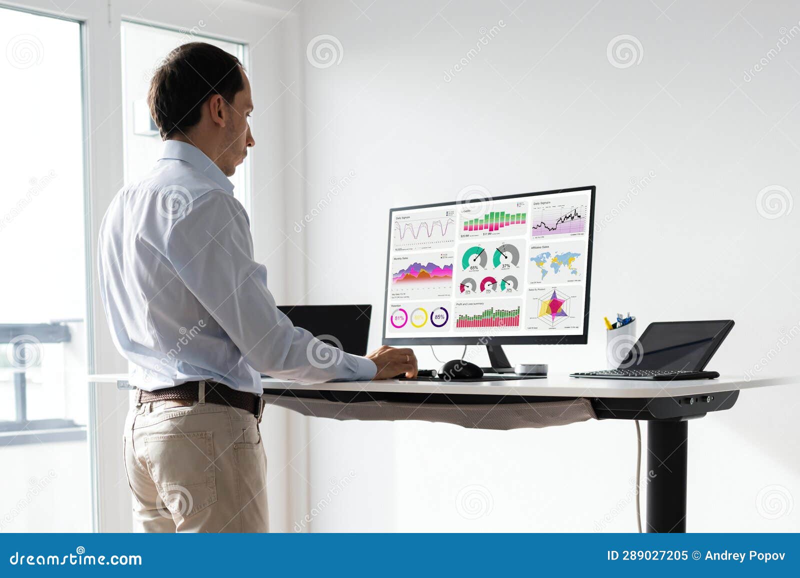 Man Working on Computer at Standing Desk Stock Image - Image of ...