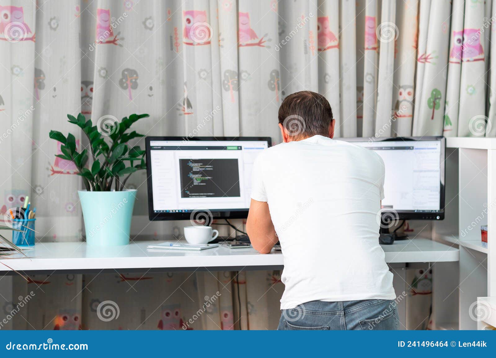 Man Working on Computer at Standing Desk at Home Office Stock Photo ...