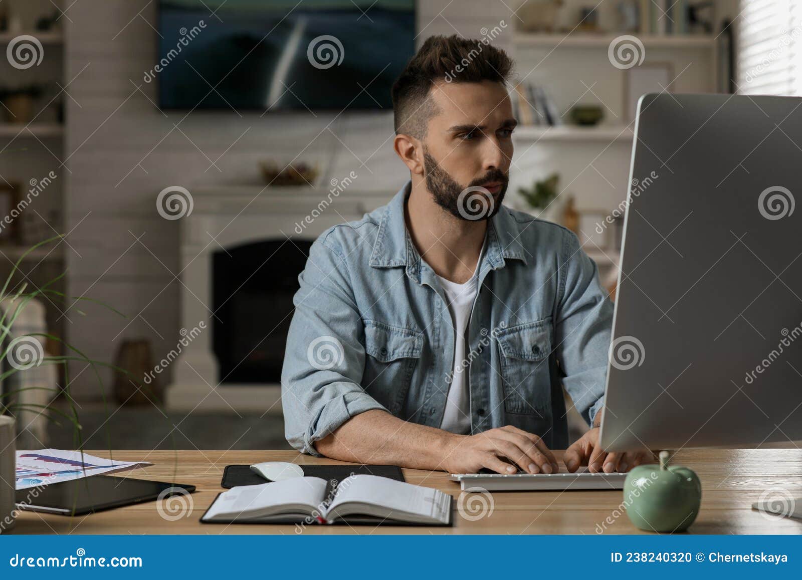Man Working with Computer at Table in Home Office, Space for Text Stock ...