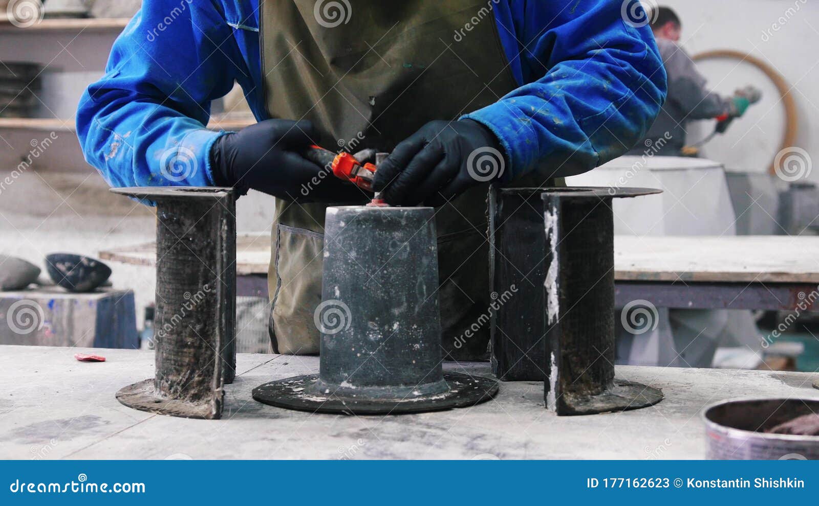 Man Working with a Concrete in the Workshop - Working with a Concrete ...