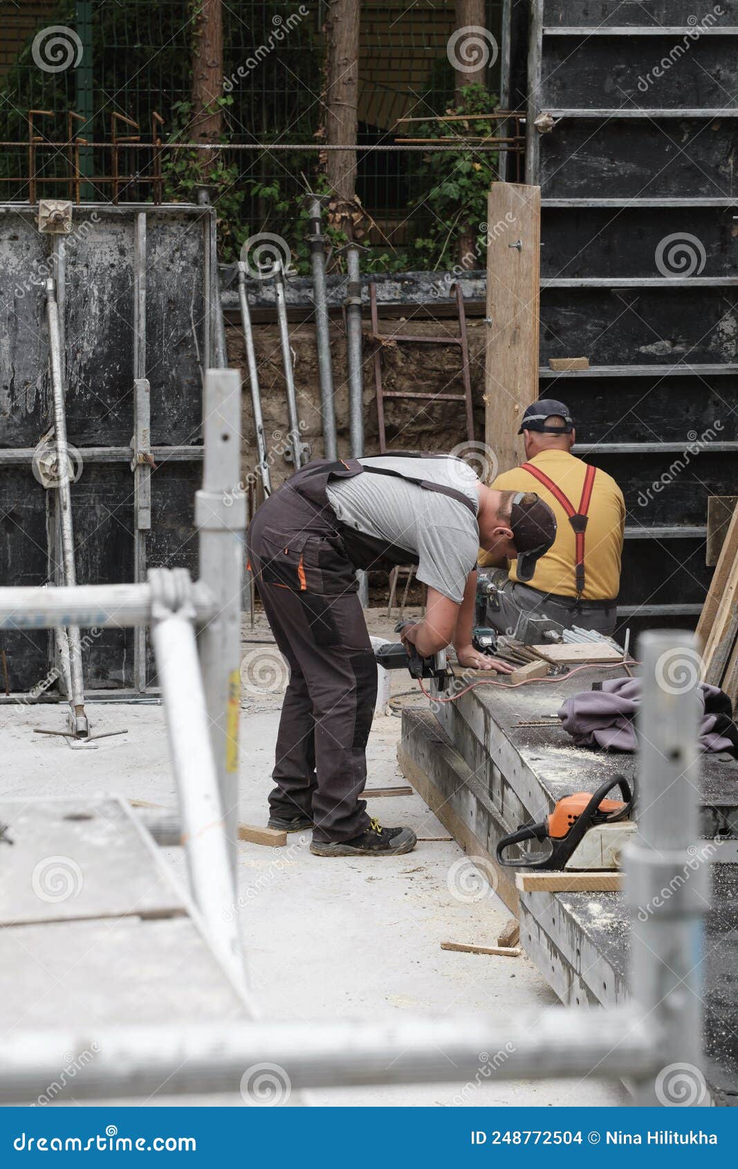 Man Working at Construction Site Building House Stock Photo - Image of ...