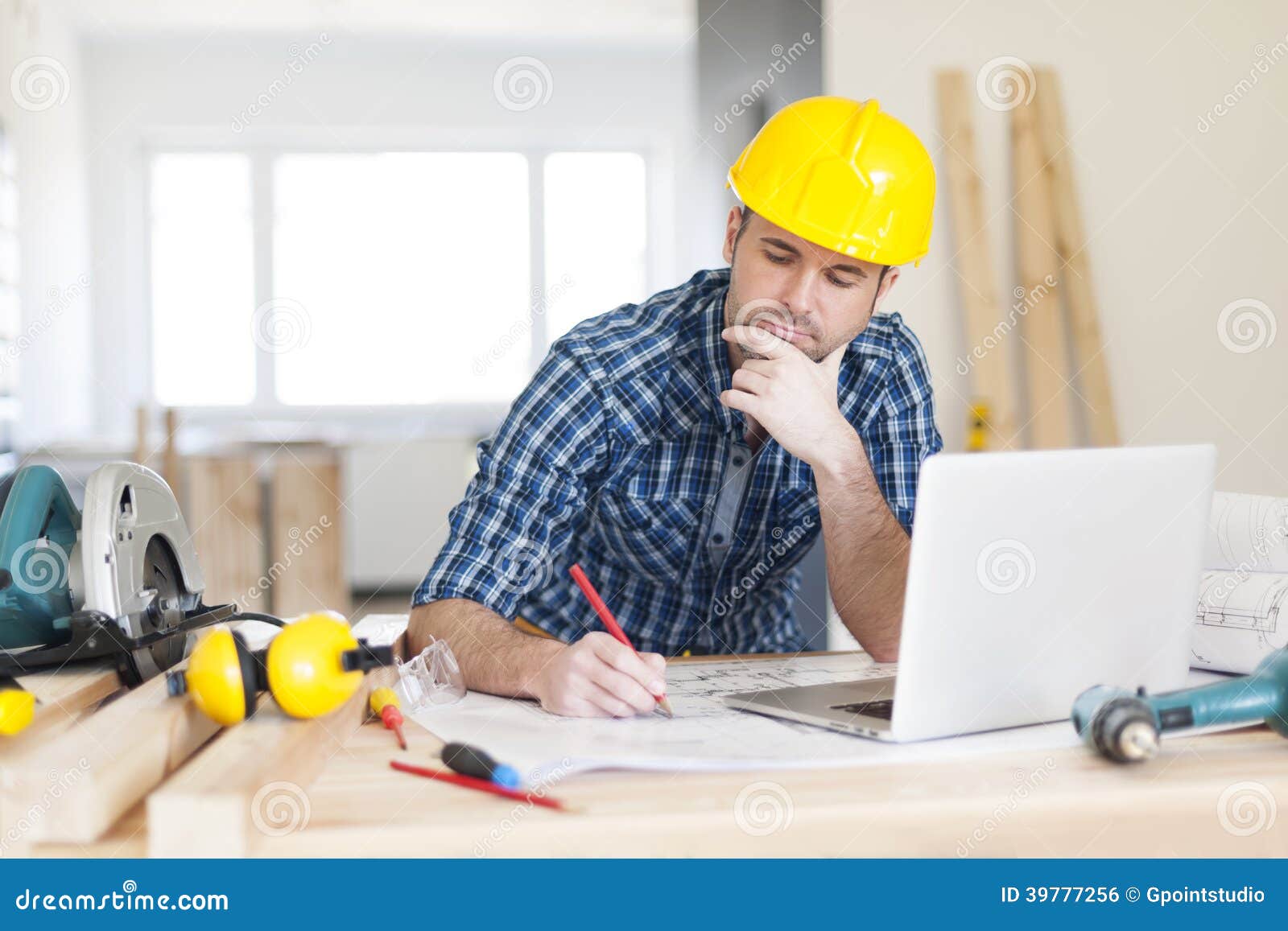 Man Working On Construction Site Stock Photo - Image of pencil, manual ...