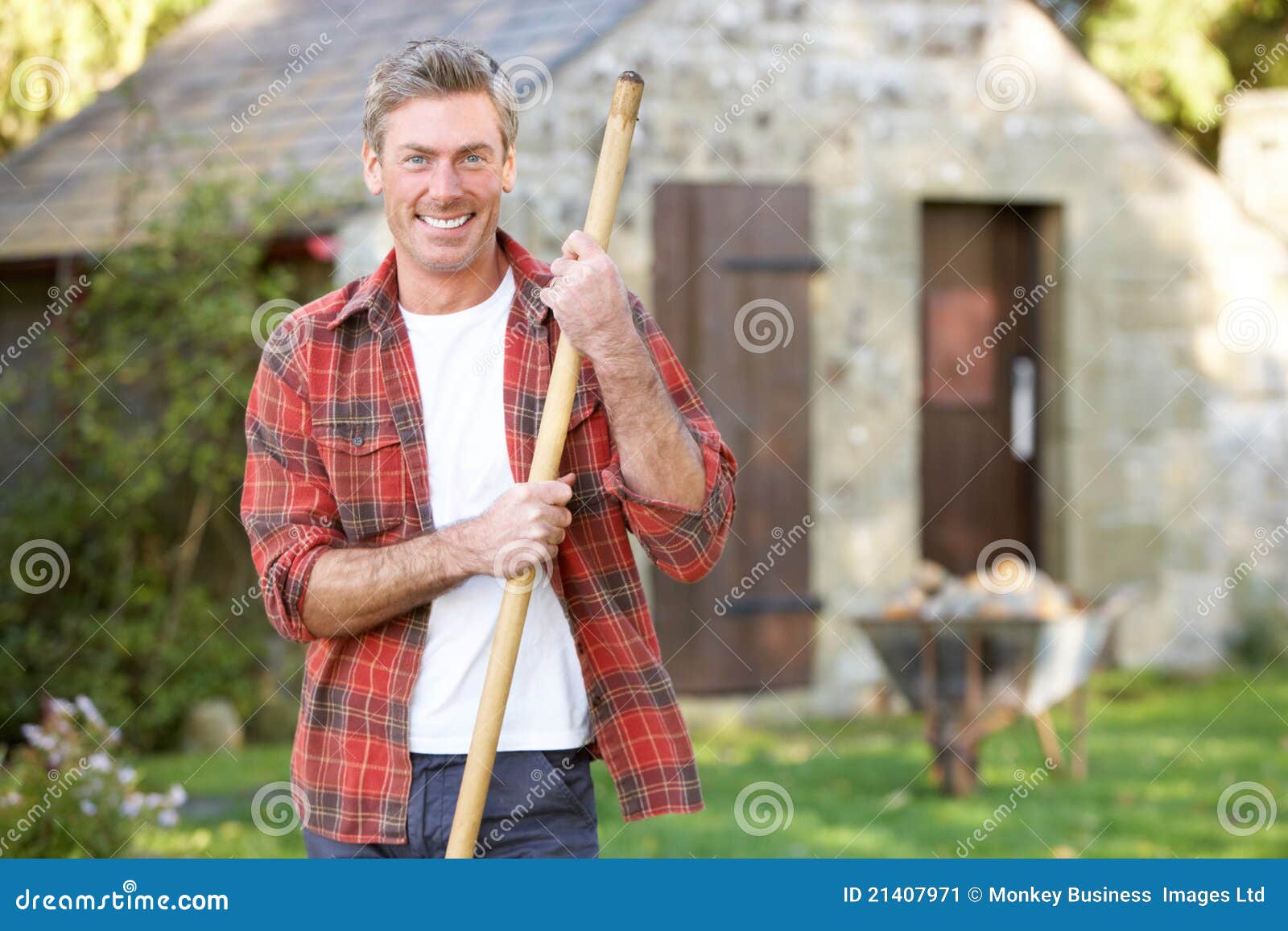 Man Working in Country Garden Stock Image - Image of collecting, barn ...