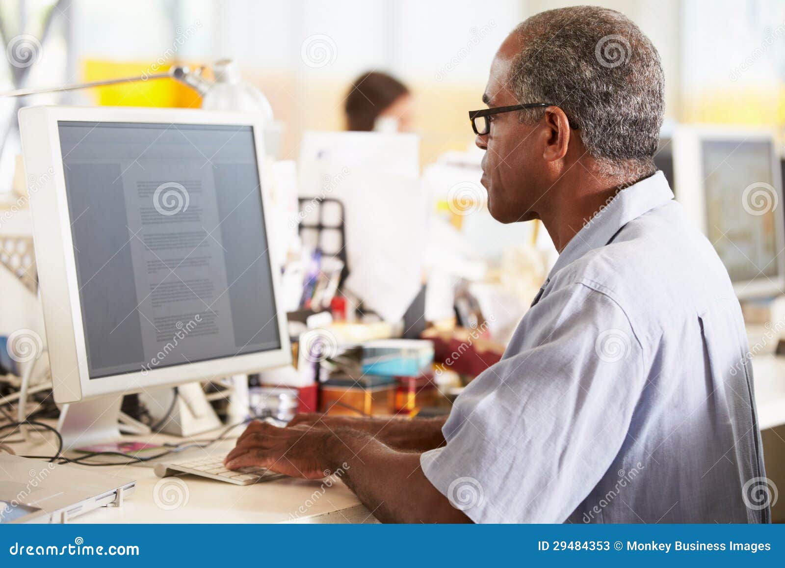 Man Working at Desk in Busy Creative Office Stock Image - Image of ...