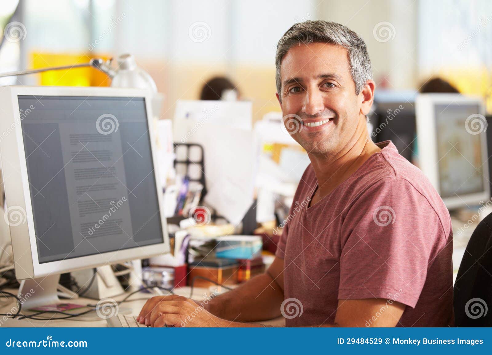 Man Working at Desk in Busy Creative Office Stock Image - Image of ...
