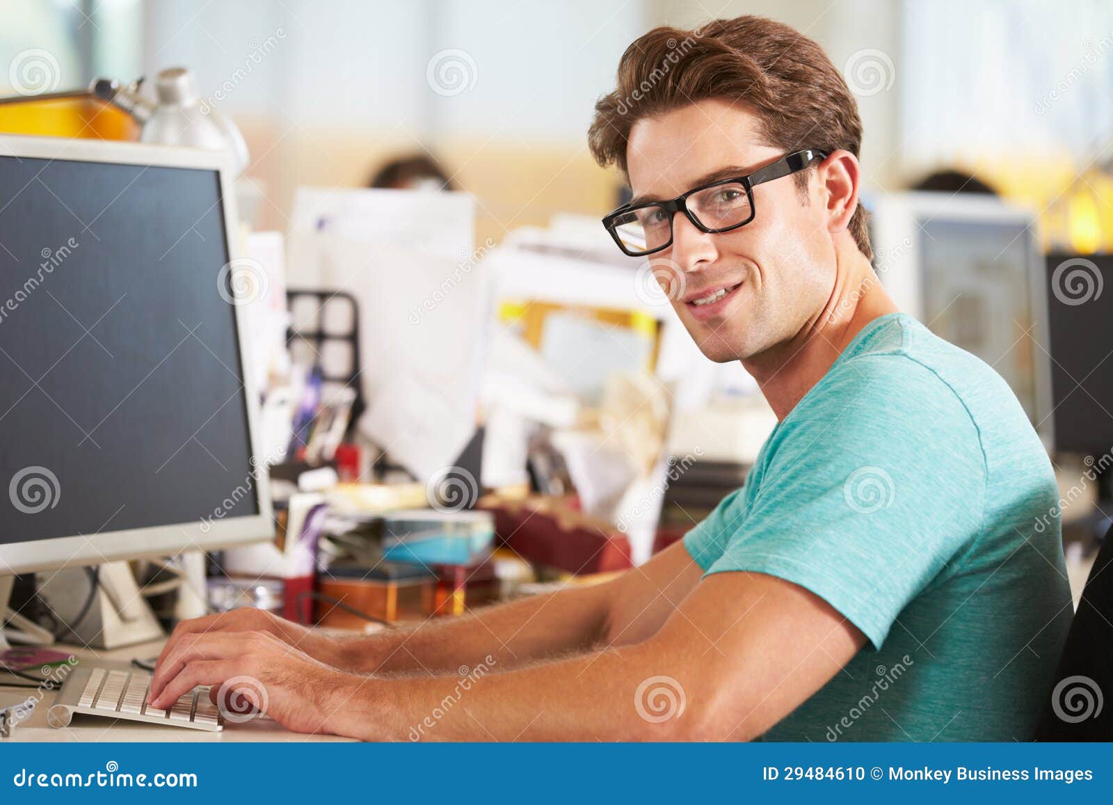 Man Working at Desk in Busy Creative Office Stock Photo - Image of ...