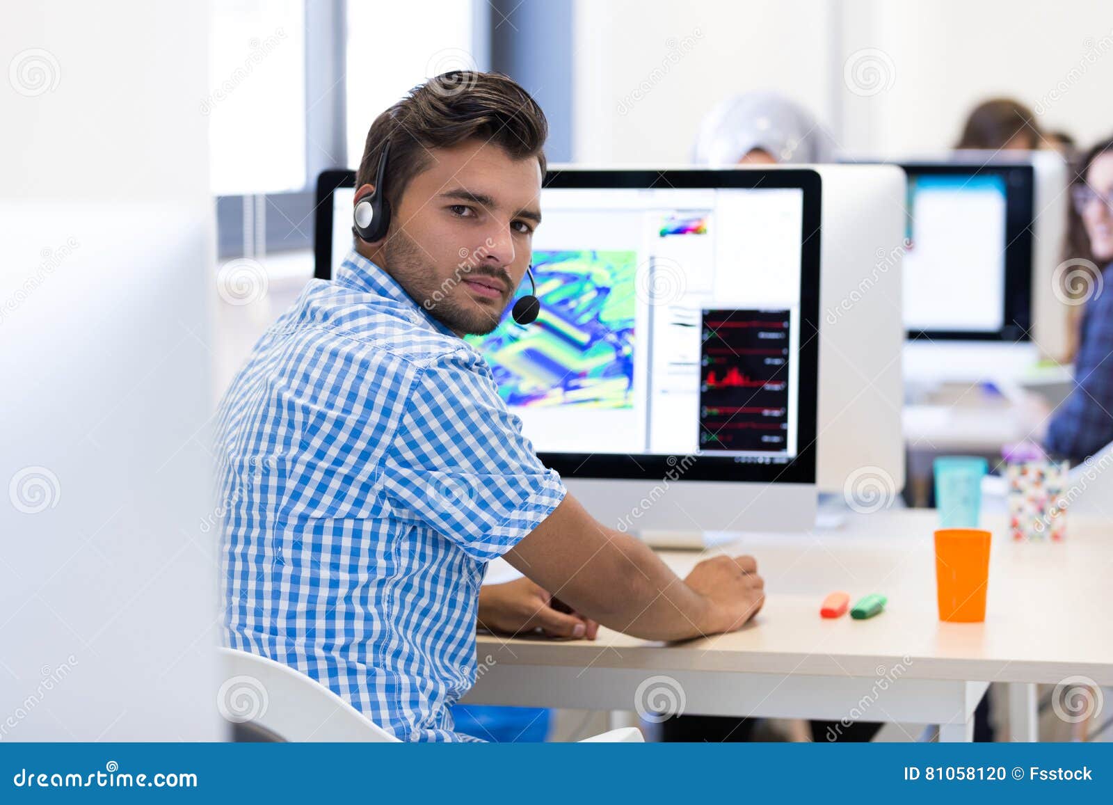 Man Working at Desk in Busy Creative Office Stock Photo - Image of ...