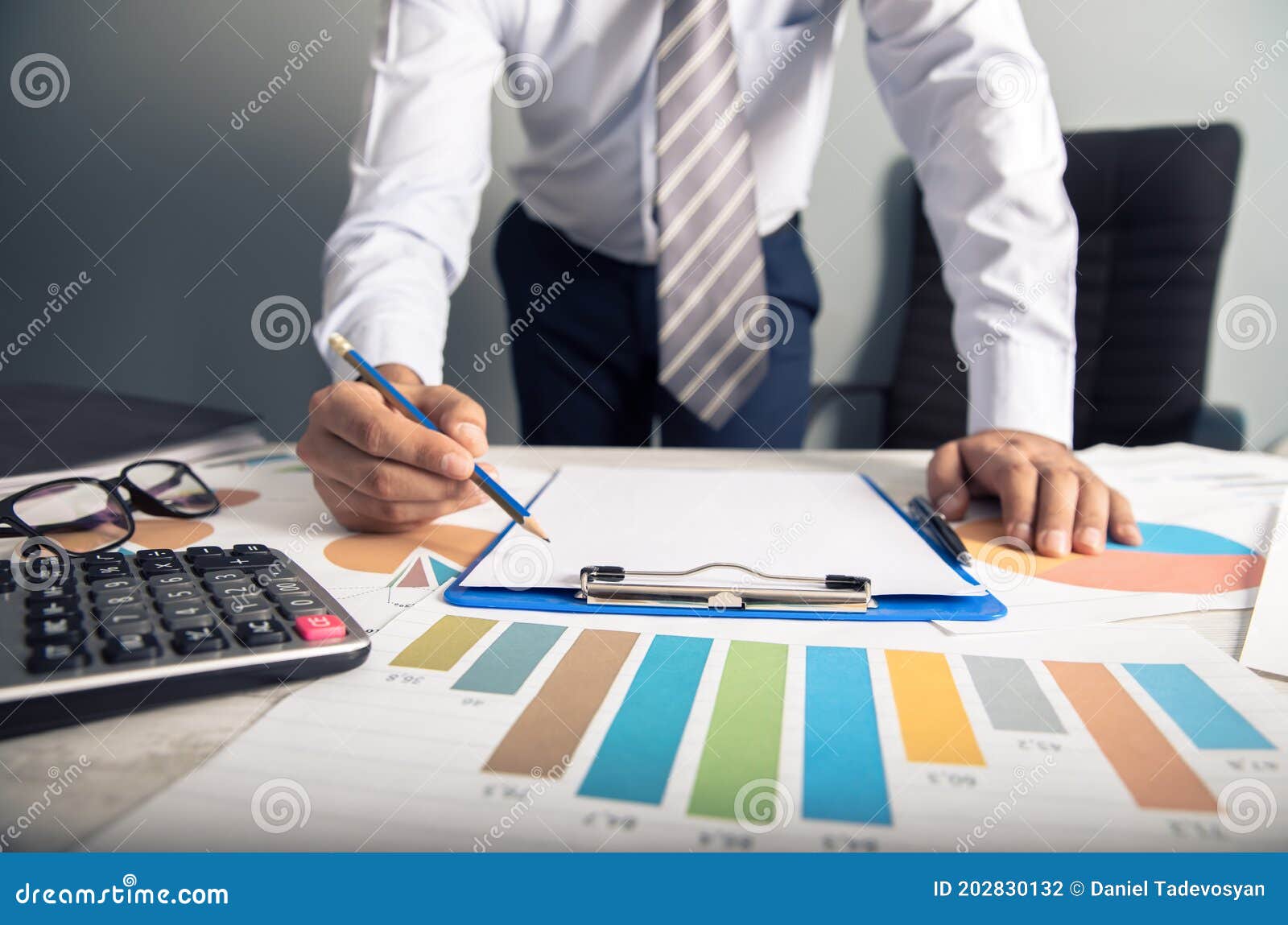 Man Working in Document with Graph Stock Photo - Image of marketing ...