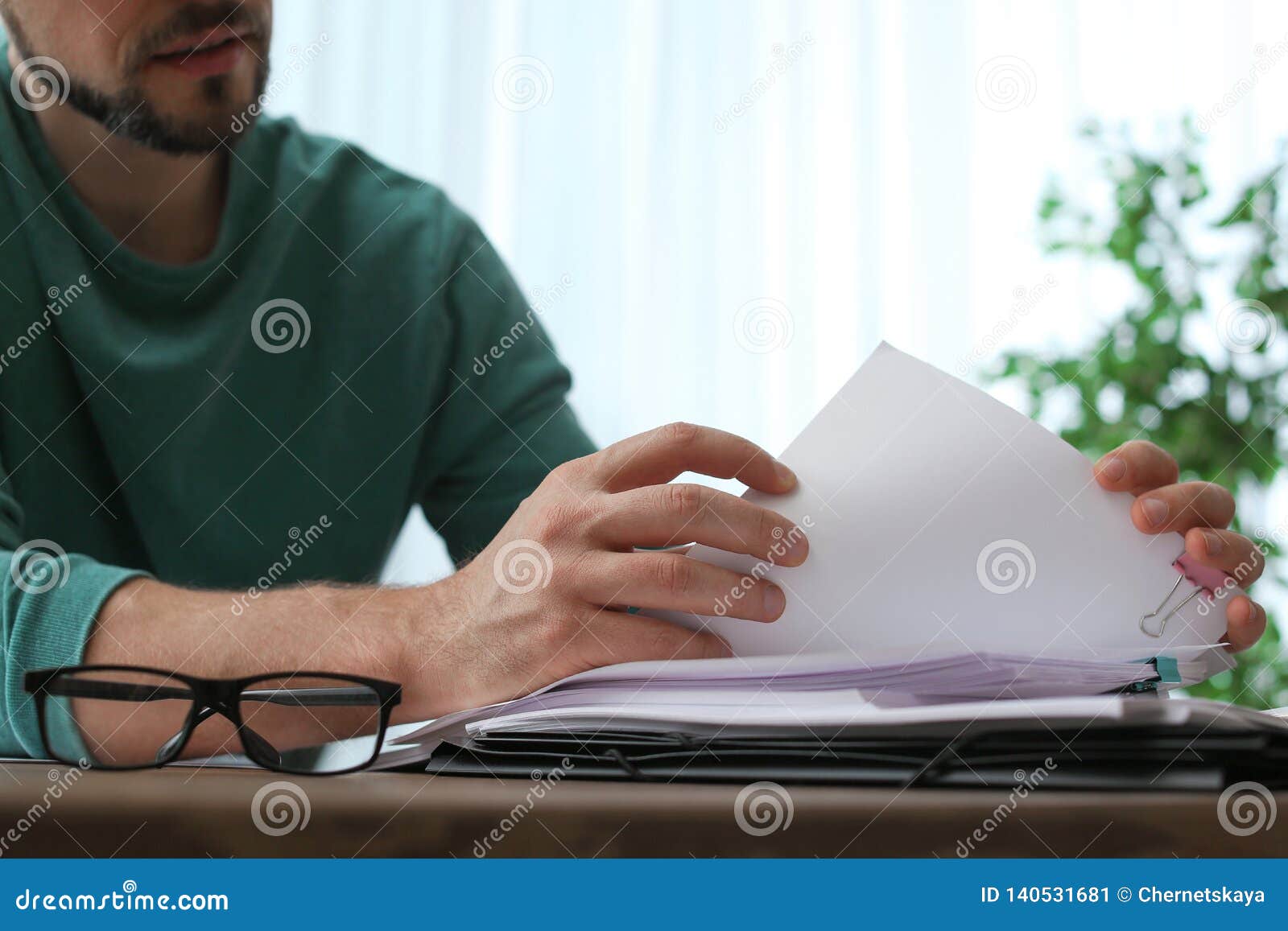 Man Working with Documents at Table in Office Stock Image - Image of ...