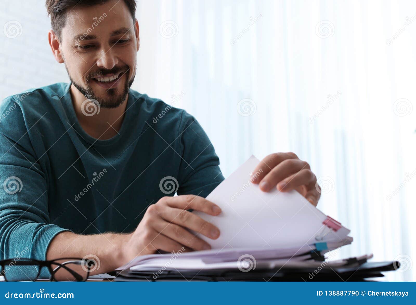 Man Working with Documents at Table in Office Stock Photo - Image of ...