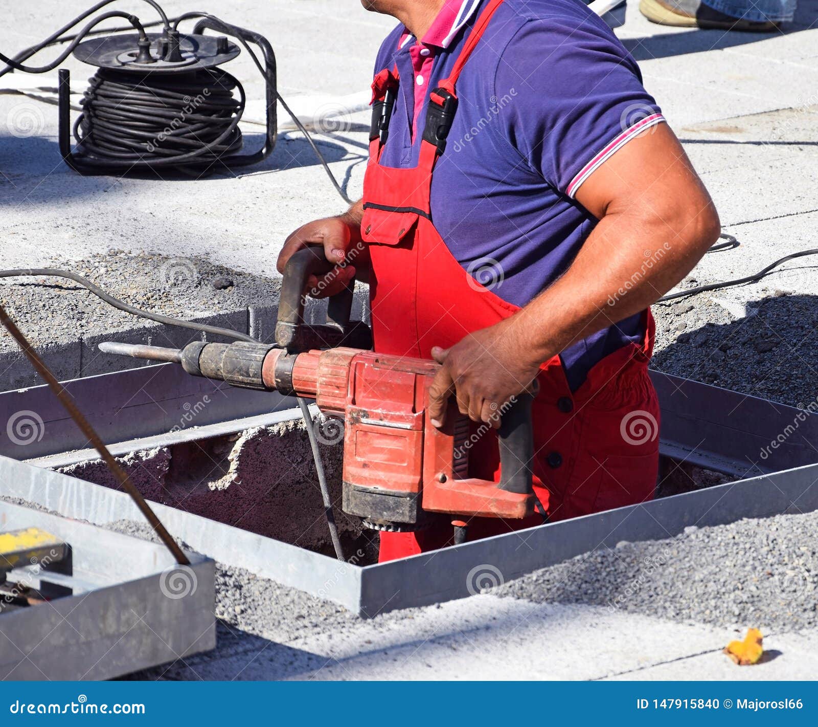Man is Working with a Drill at the Construction Site Stock Photo ...