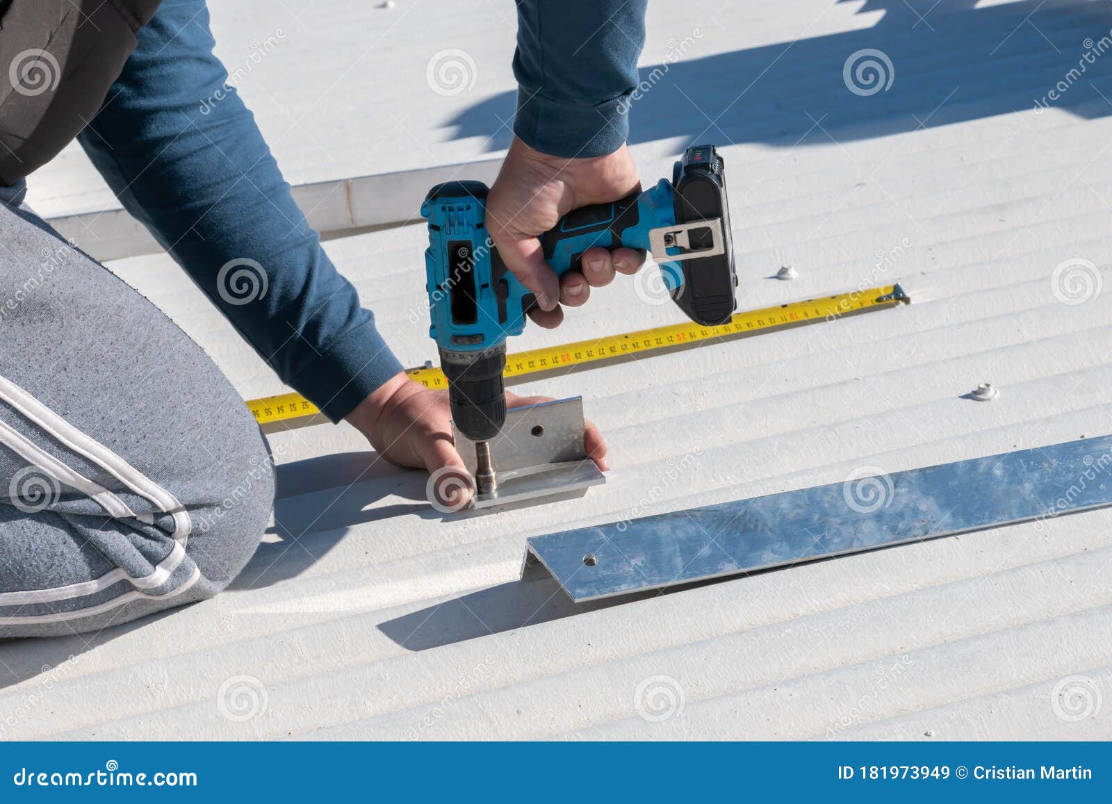 Man Working with Drill in Solar Panel Installation Stock Image - Image ...
