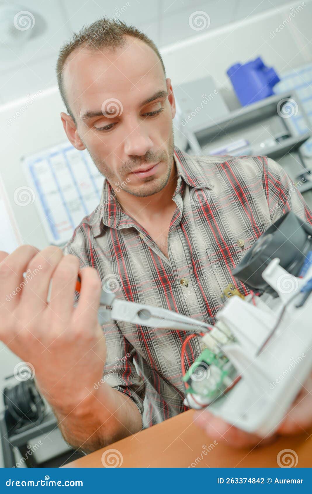 Man Working on Electrical Appliance Stock Photo - Image of hardware ...