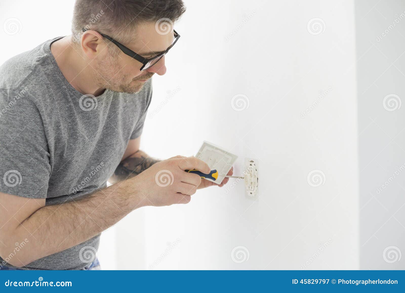Man Working on Electrical Outlet Stock Image - Image of installing ...