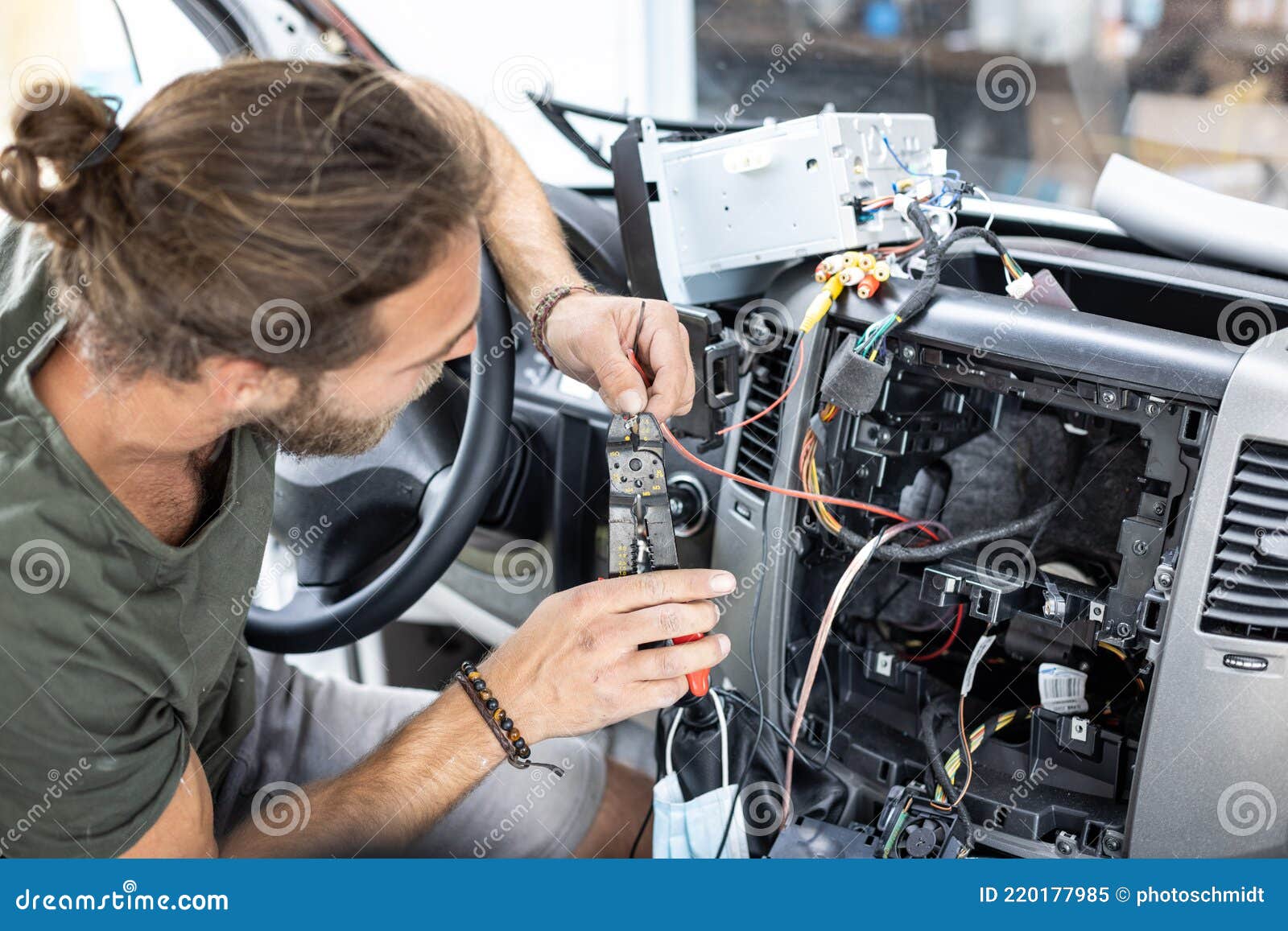 Man Working on Electronics Inside a Car Stock Image - Image of console ...