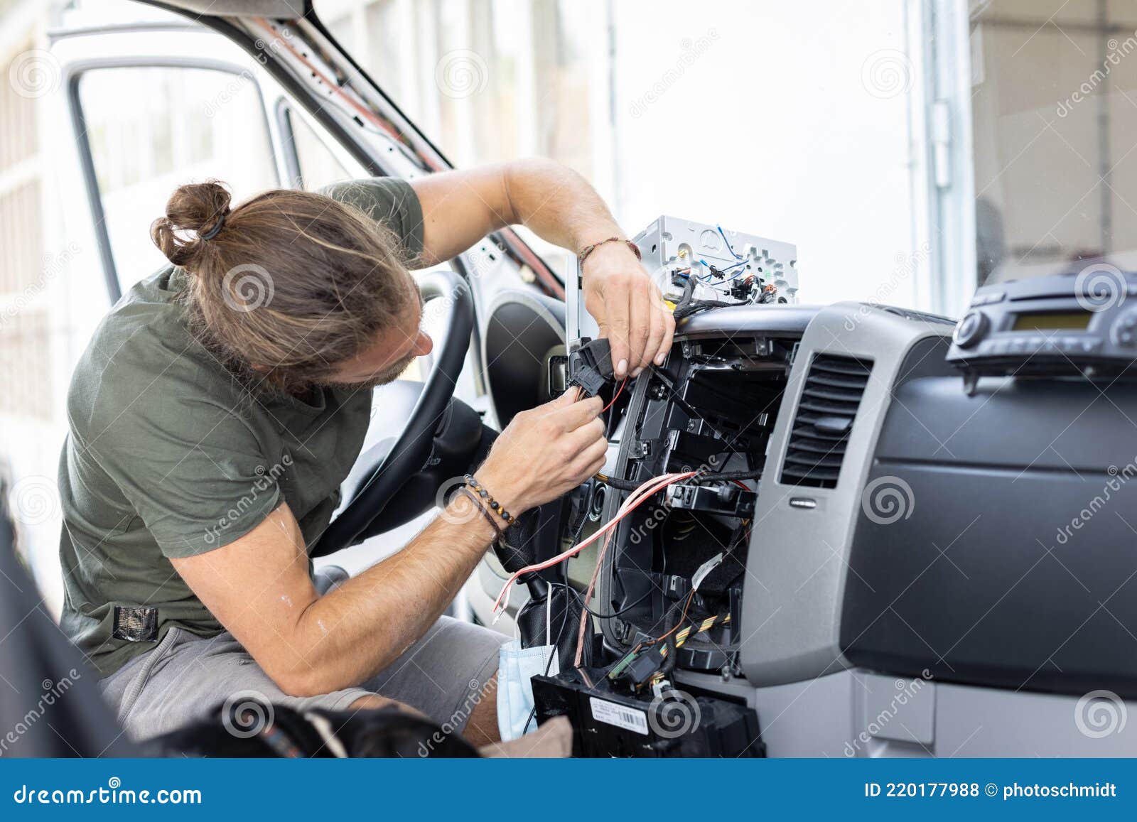 Man Working on Electronics Inside a Van Stock Photo - Image of ...