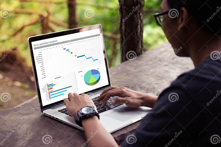 Man Working with Excel Project Dashboard on Laptop / Computer Stock ...
