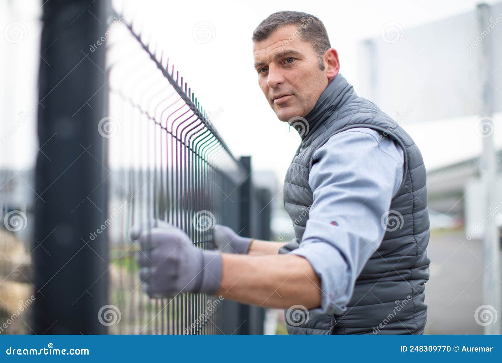 Man working on fence stock photo. Image of contractor - 248309770