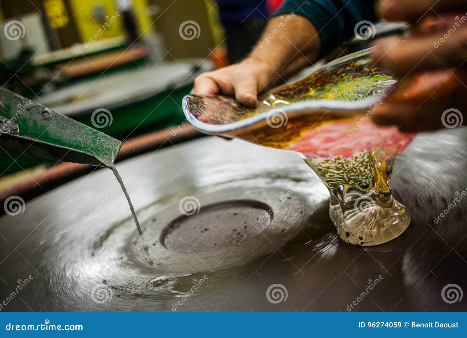 Man Working a Glass Blown Vase on Spinning Silica Sanding Disk Stock ...