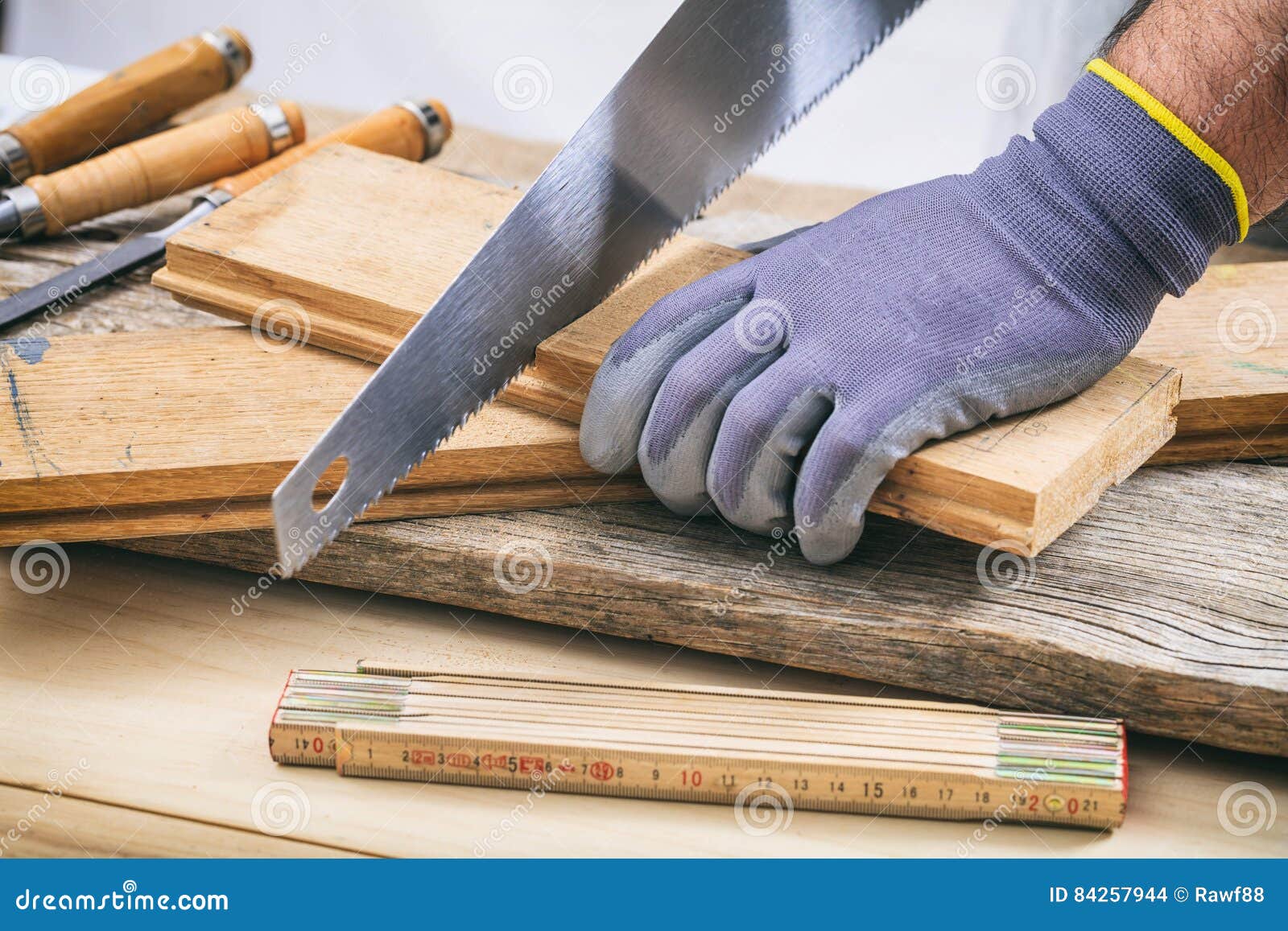 Man Working with a Hand Saw Stock Photo - Image of glove, industry ...