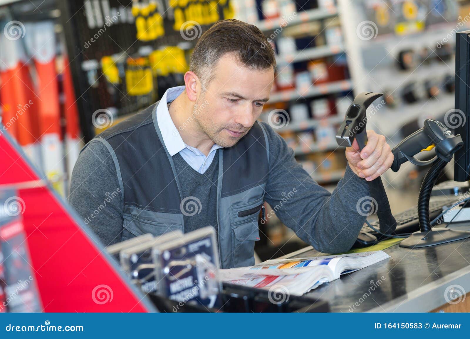 Man working hardware store stock image. Image of equipment - 164150583