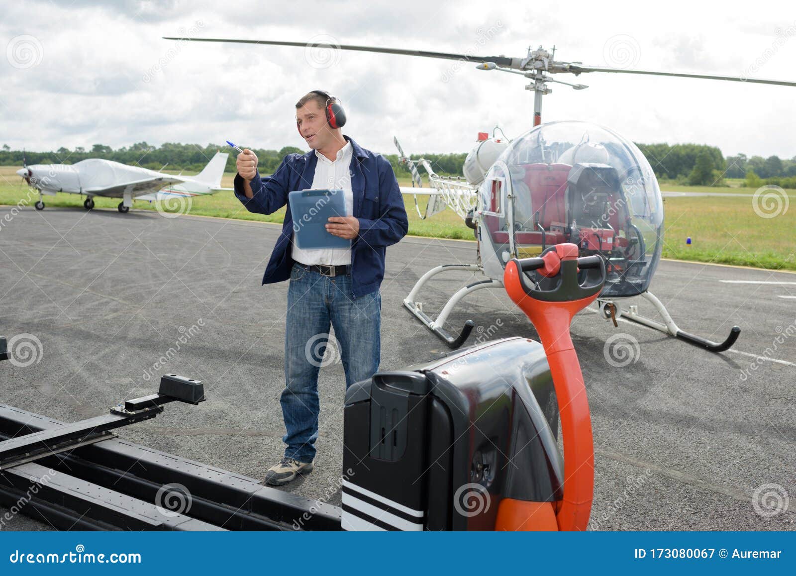 Man Working with Helicopter Stock Image - Image of standing, stand ...