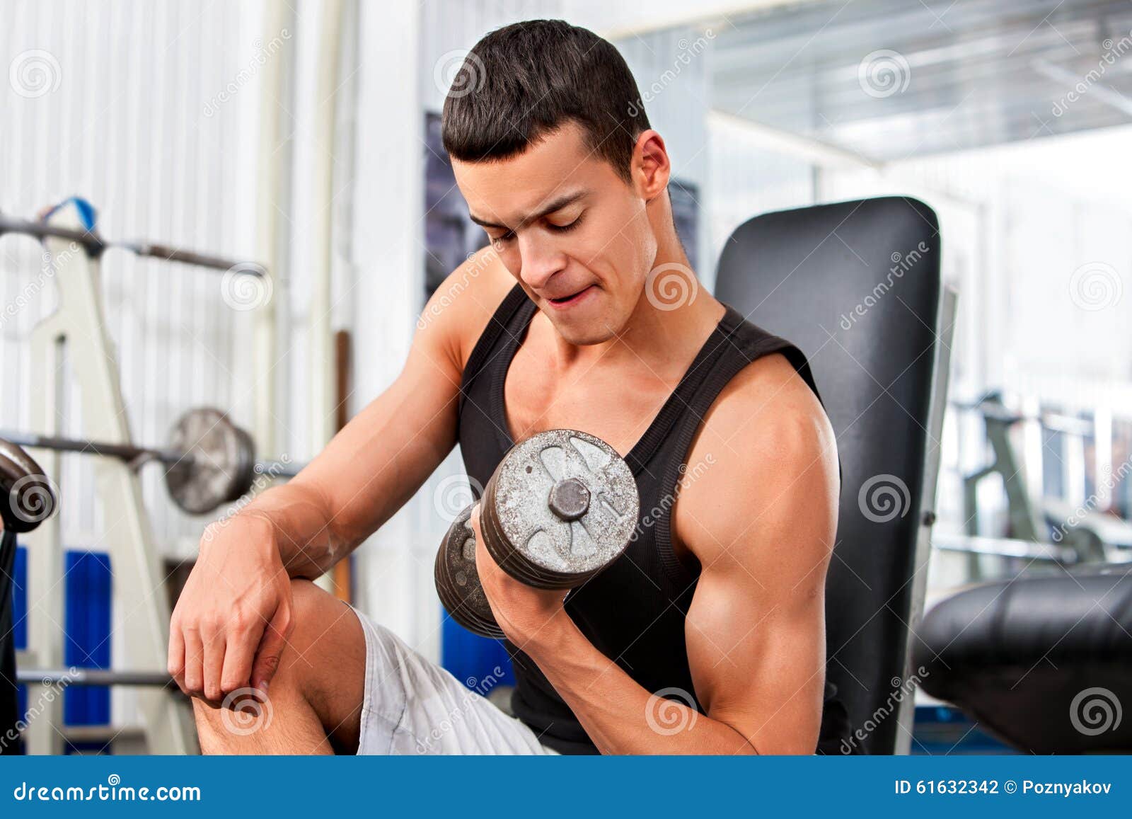 Man Working His Arms with Dumbbells at Gym Stock Photo - Image of ...