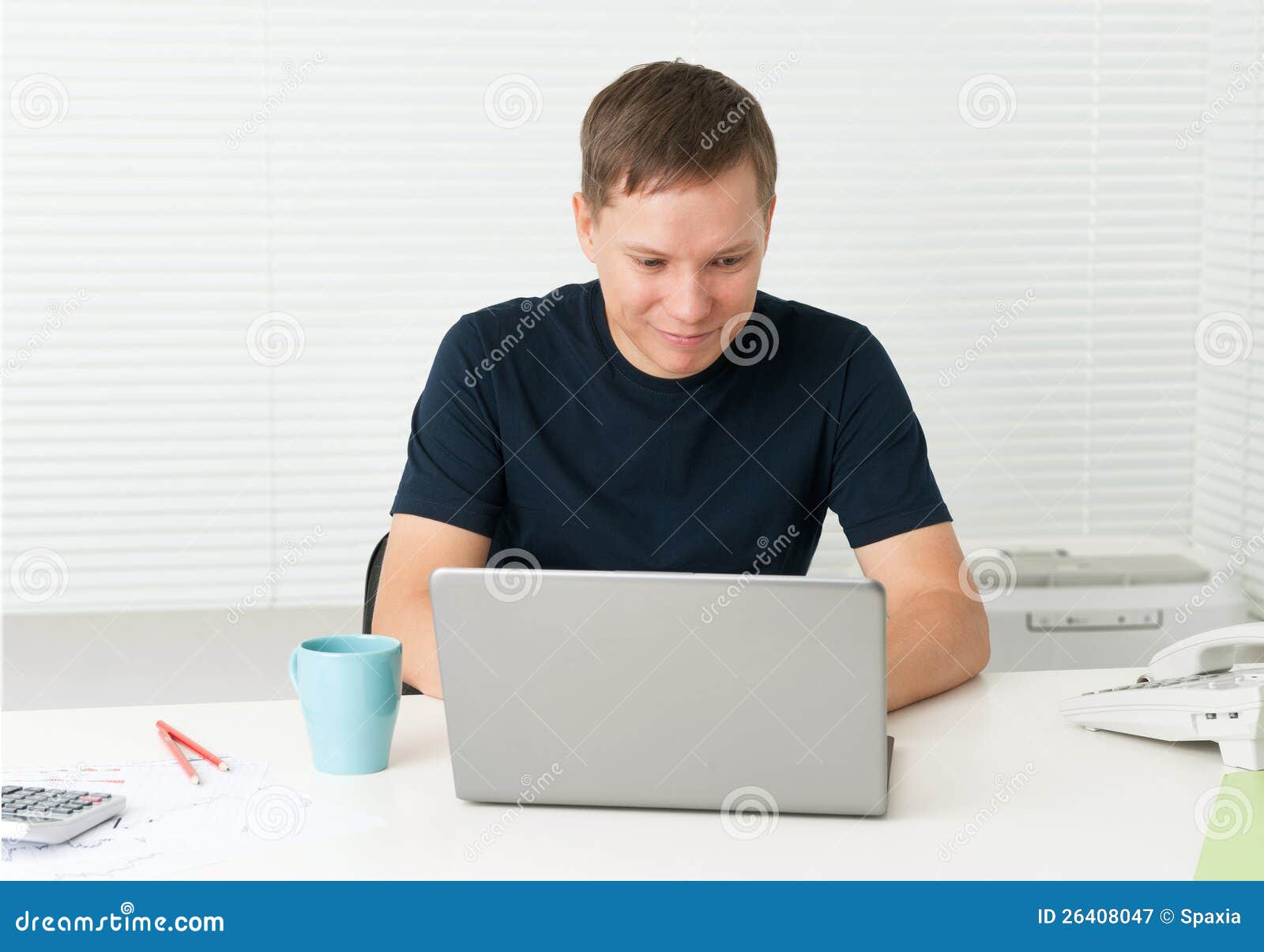 Man working on his laptop stock image. Image of business - 26408047