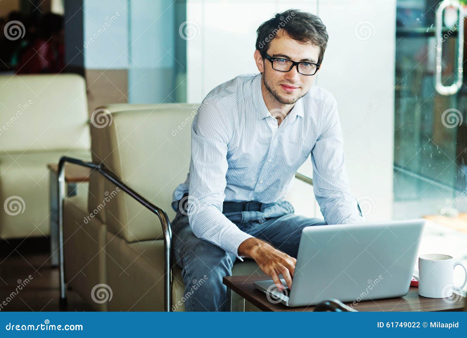 Man working on his laptop stock photo. Image of computer - 61749022