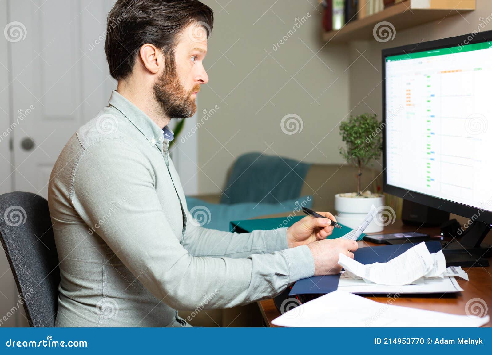 Man Working from Home on Desktop Computer with Paperwork. HD 24FPS ...