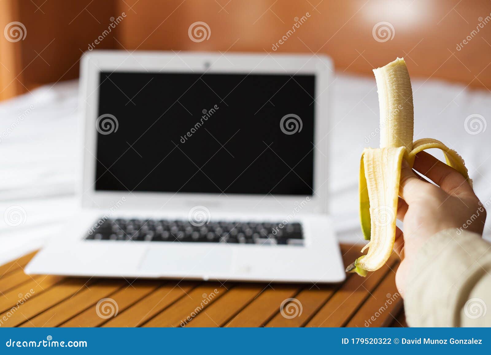 Man Working at Home and Eating a Banana Stock Photo - Image of laptop ...