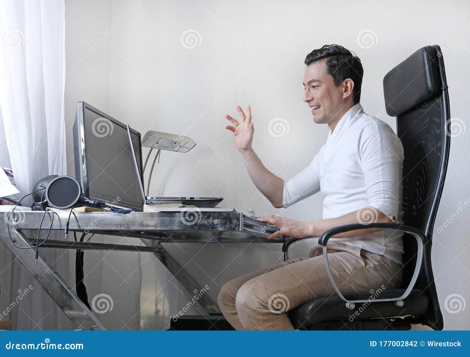Man Working from Home with a Laptop in the Living Room Stock Photo ...