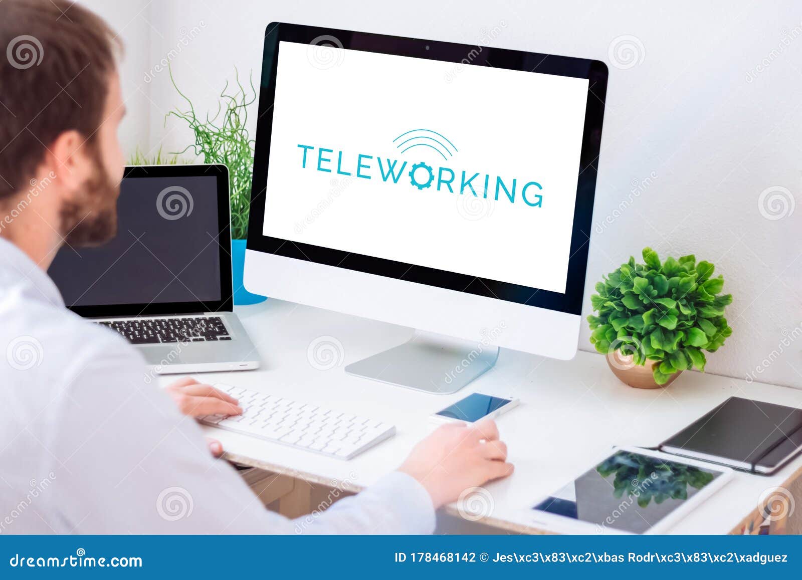 Man Working from Home Using Computer with Teleworking Logo on the ...