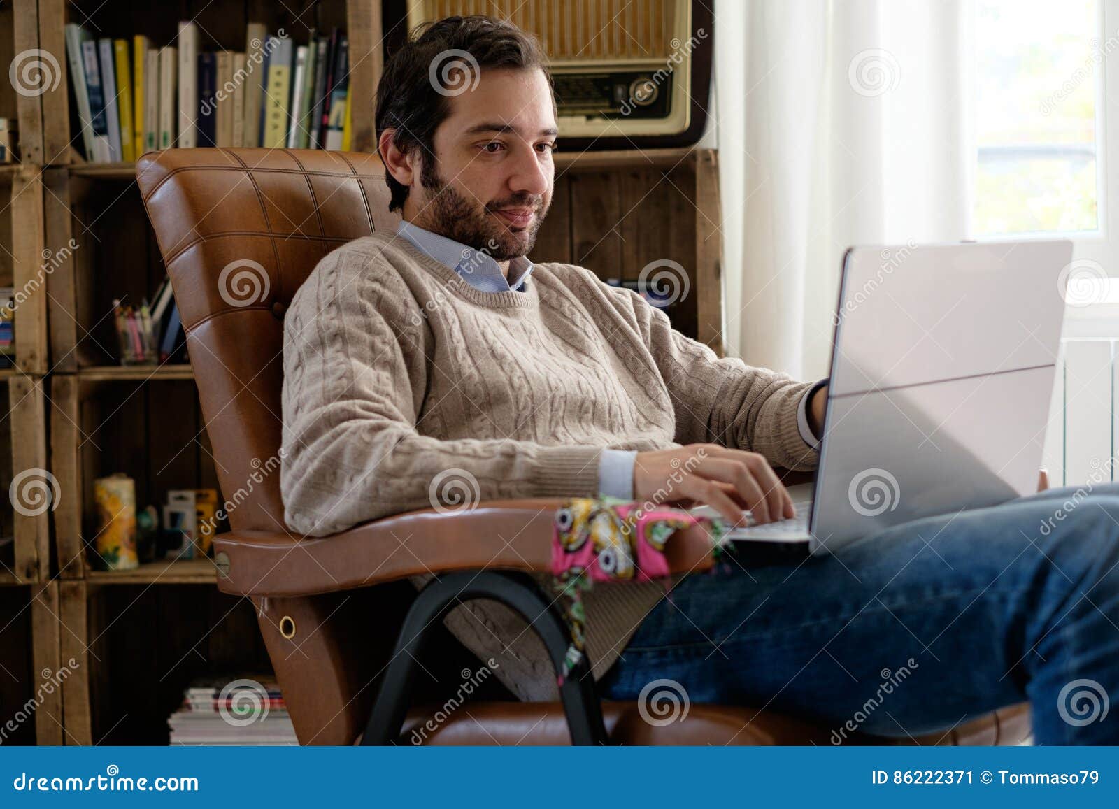 Man Working at Home Using His Laptop and Wi-fi Internet Connection ...
