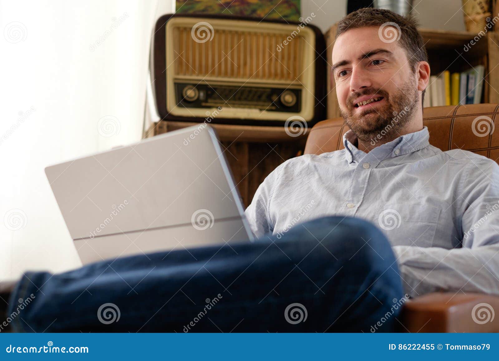 Man Working at Home Using His Laptop and Wi-fi Internet Connection ...
