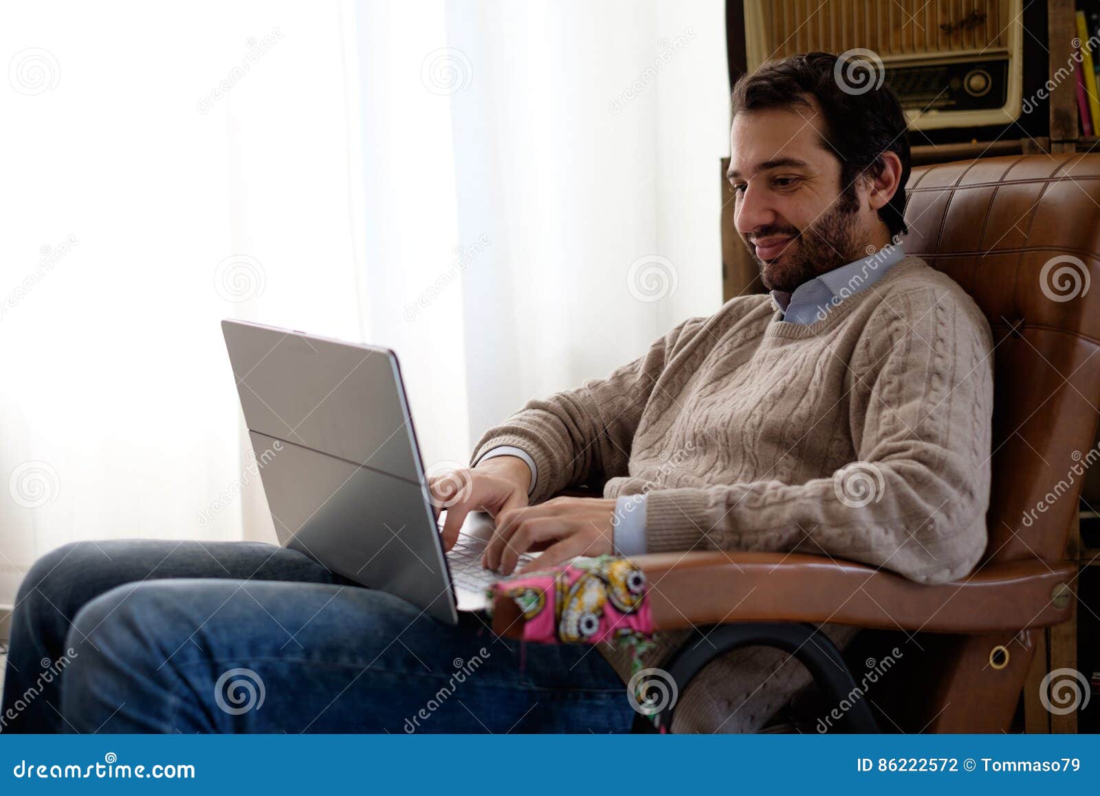 Man Working at Home Using His Laptop and Wi-fi Internet Connection ...