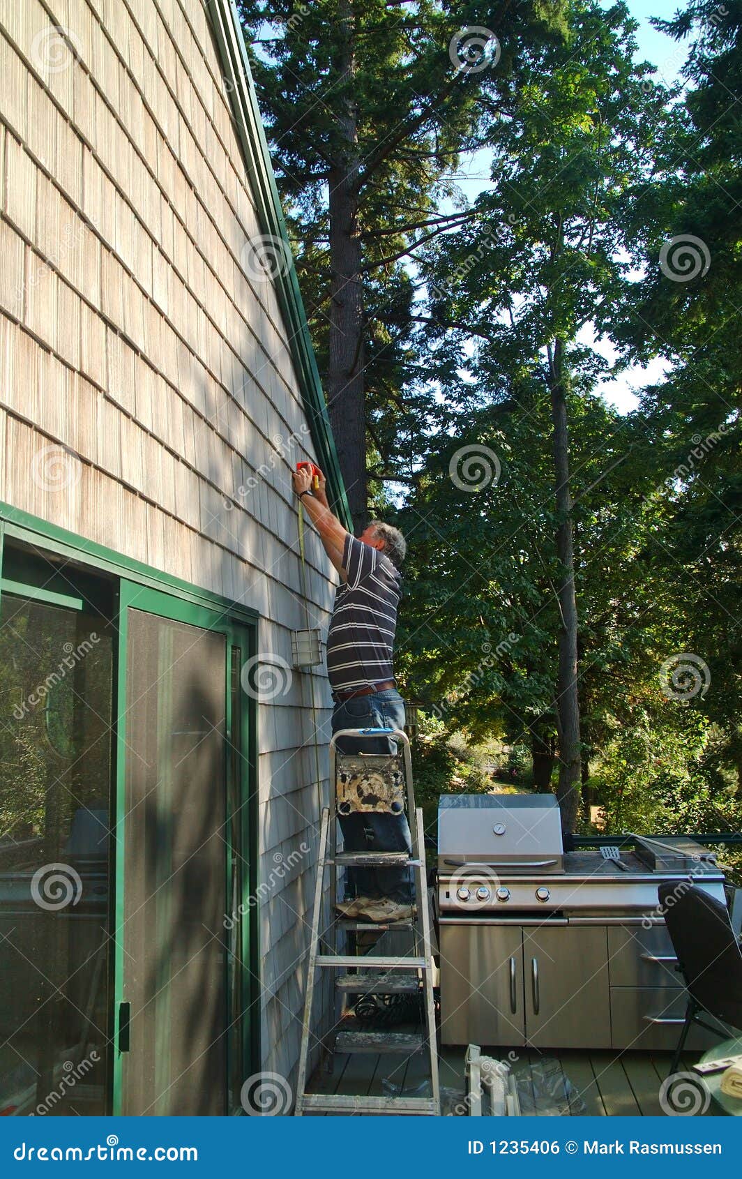 Man working on house stock photo. Image of tape, improving - 1235406