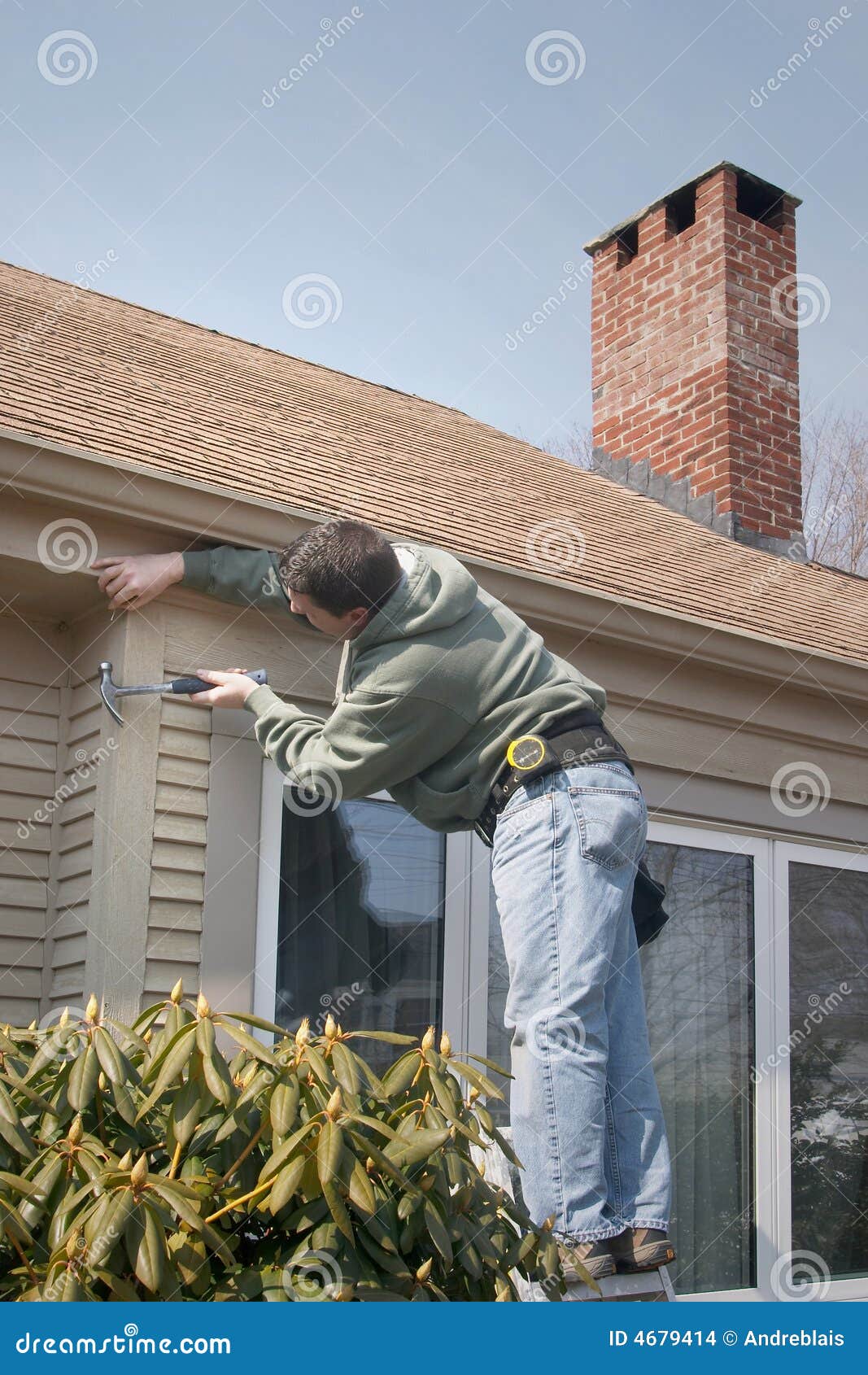 Man working on house stock photo. Image of house, jeans - 4679414