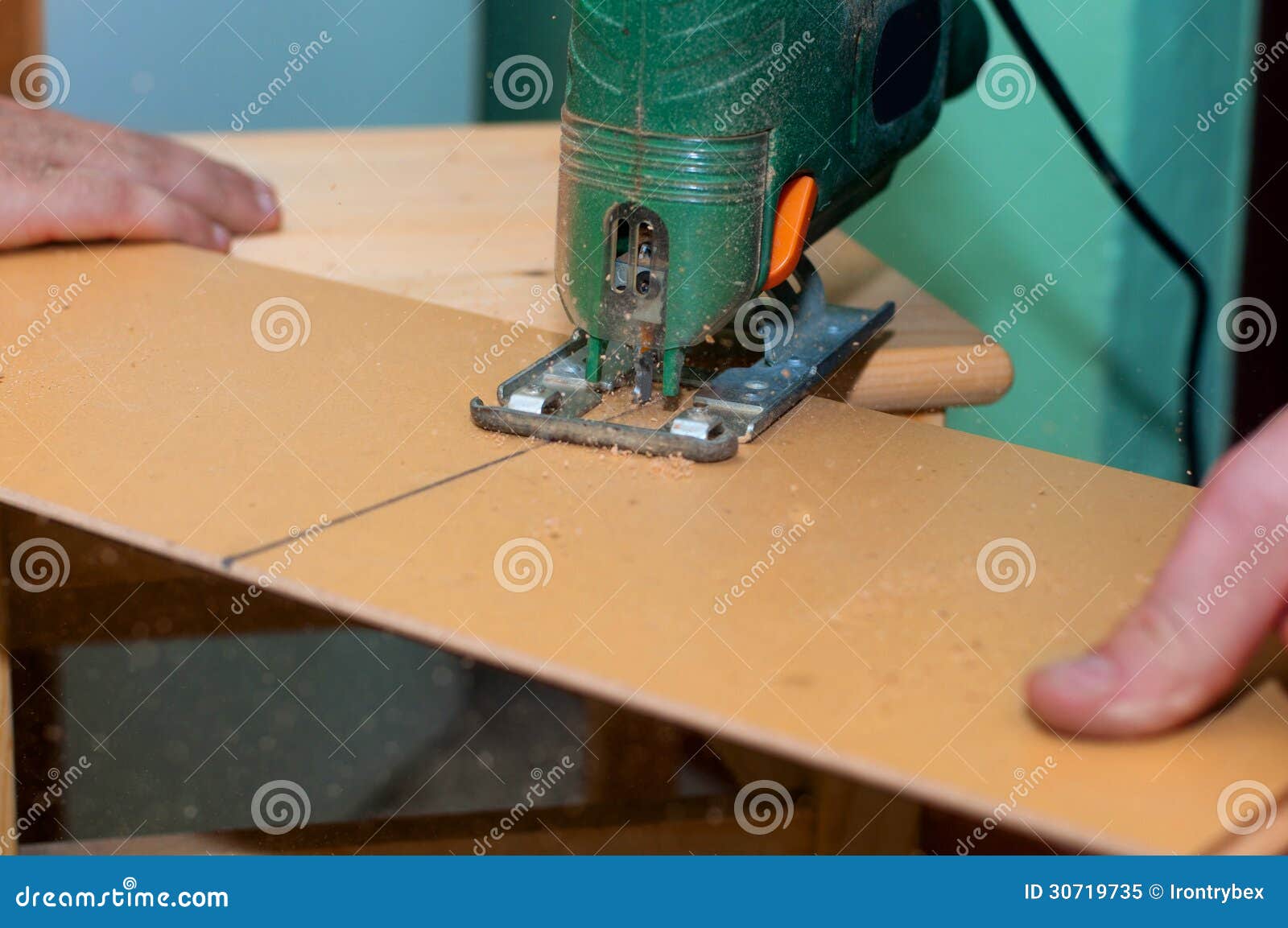 Man working with jigsaw stock image. Image of sawhorse - 30719735