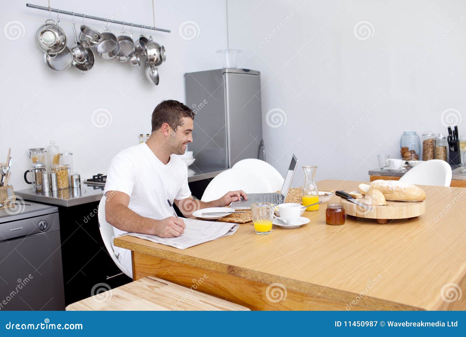 Man Working in Kitchen while Having Breakfast Stock Image - Image of ...
