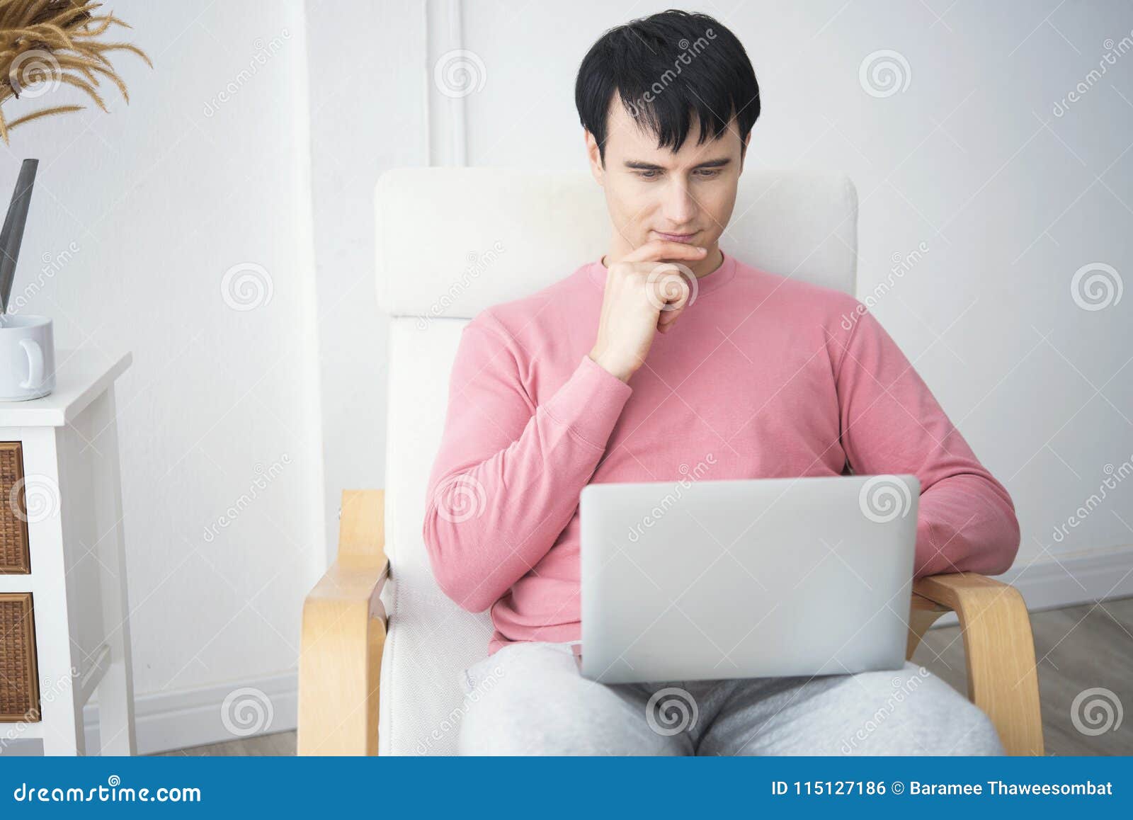 Man Working on Laptop Computer with Thinking Thoughtful Stock Photo ...