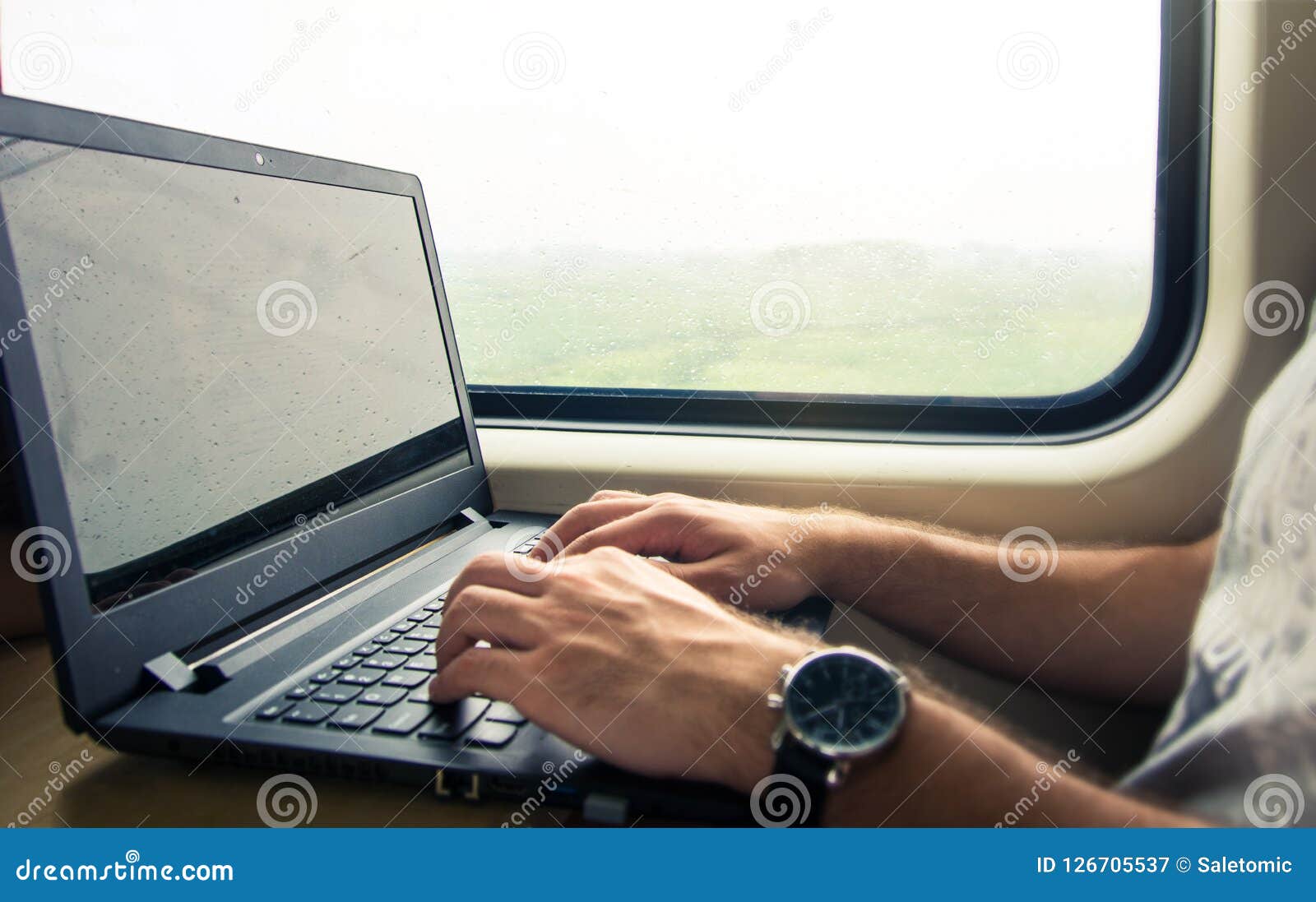Man Working on Laptop in a Train Stock Image - Image of laptop, phone ...