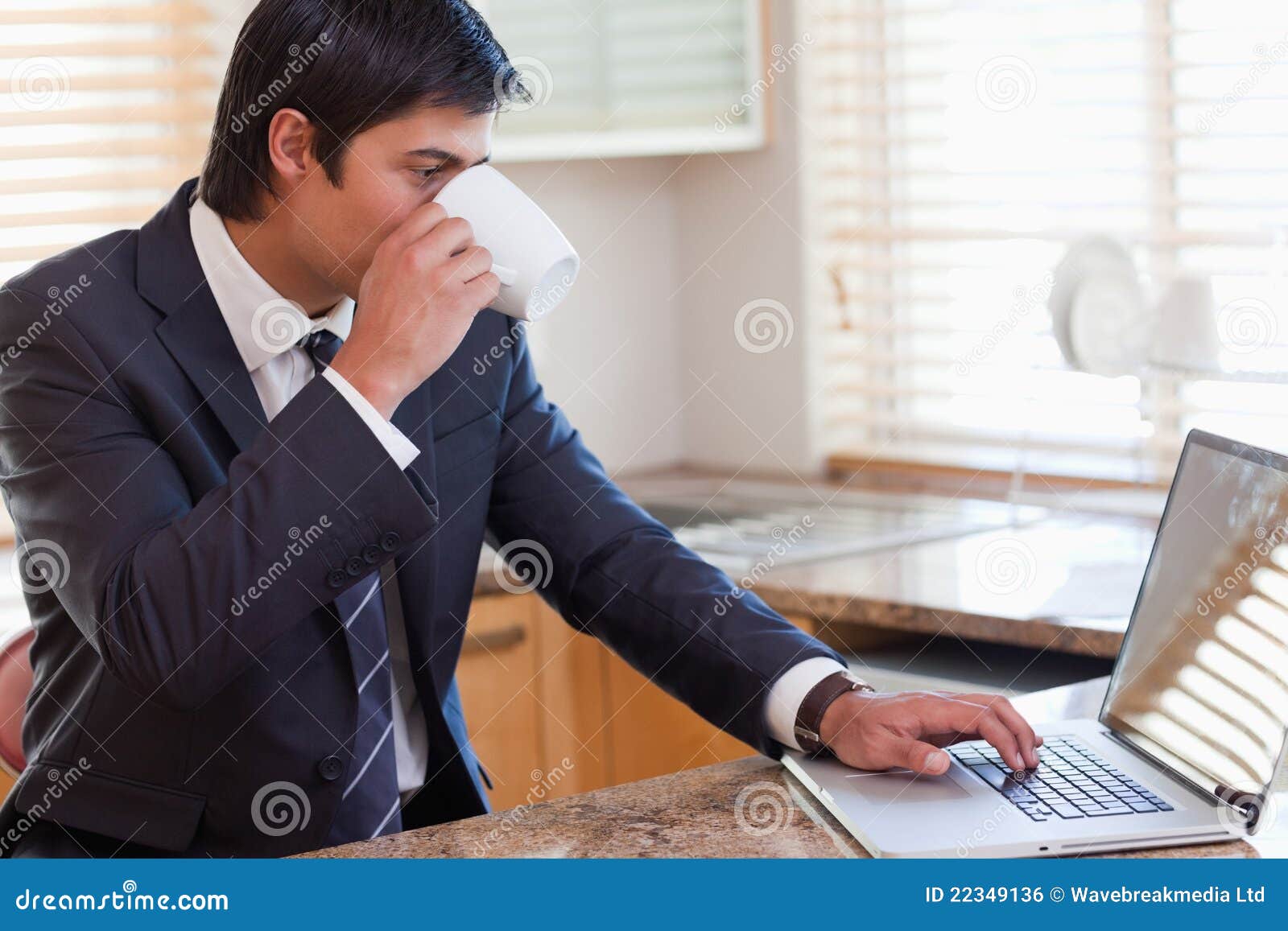 Man Working with a Laptop while Drinking Tea Stock Photo - Image of ...