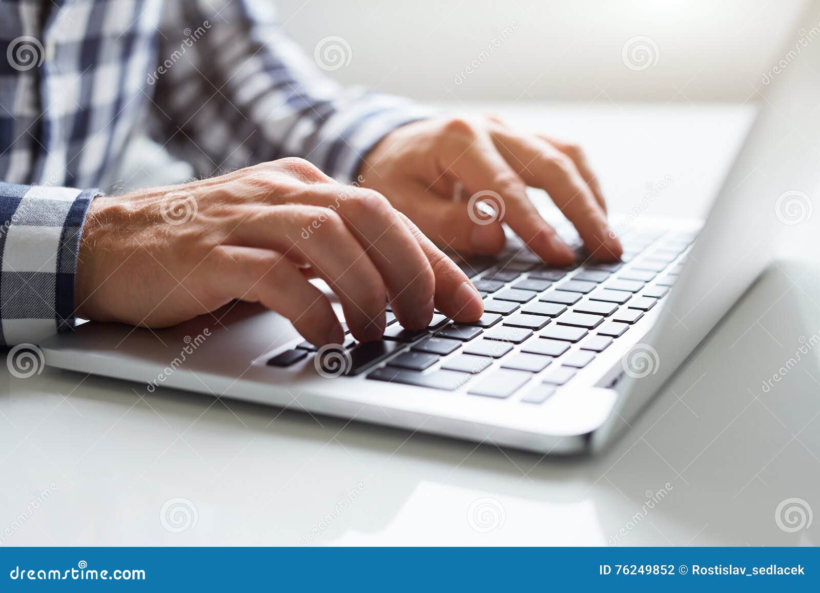 Man working on a laptop stock photo. Image of closeup - 76249852