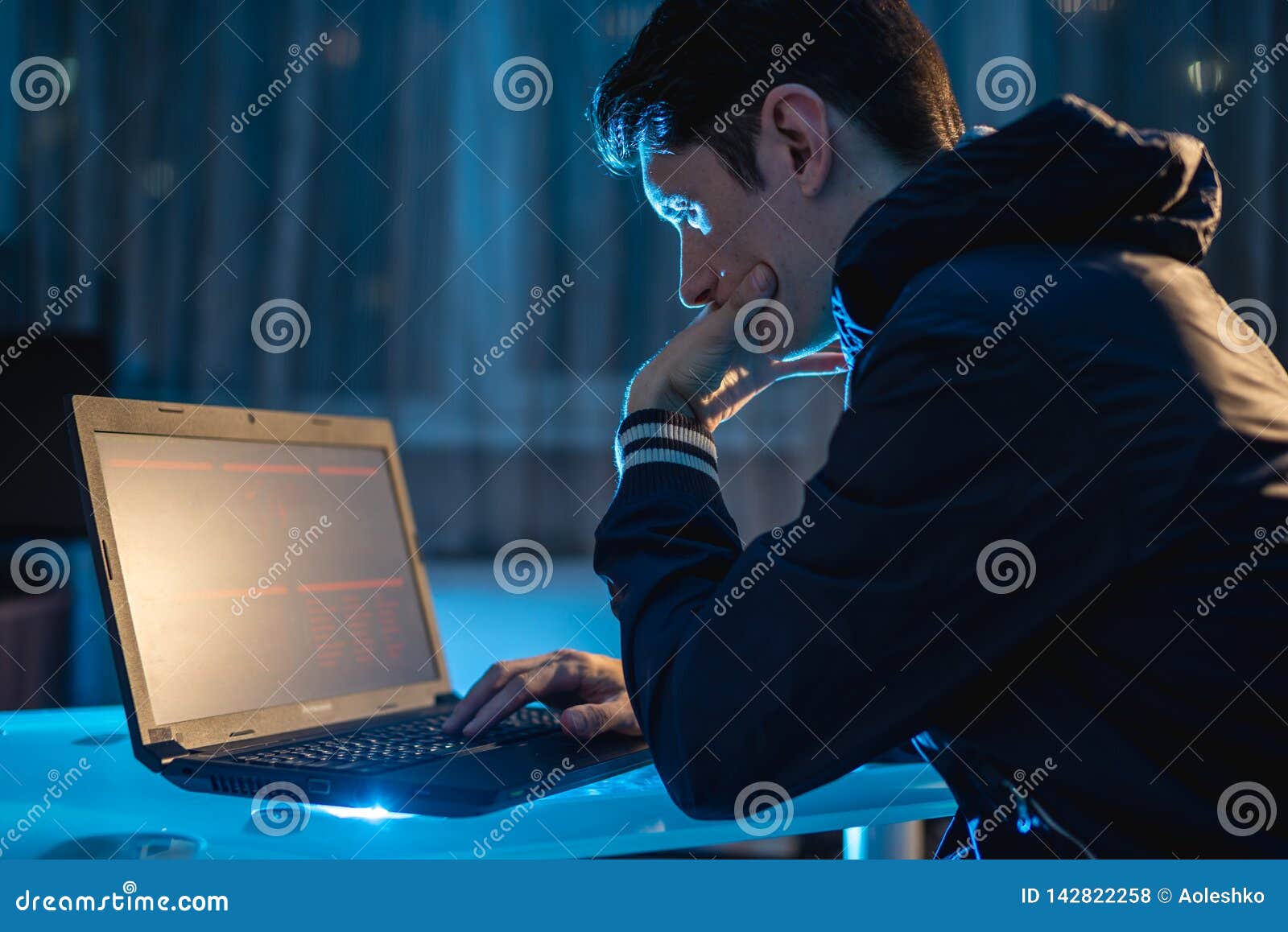 Man Working on a Laptop at Night. Freelancer System Administrator Tries ...