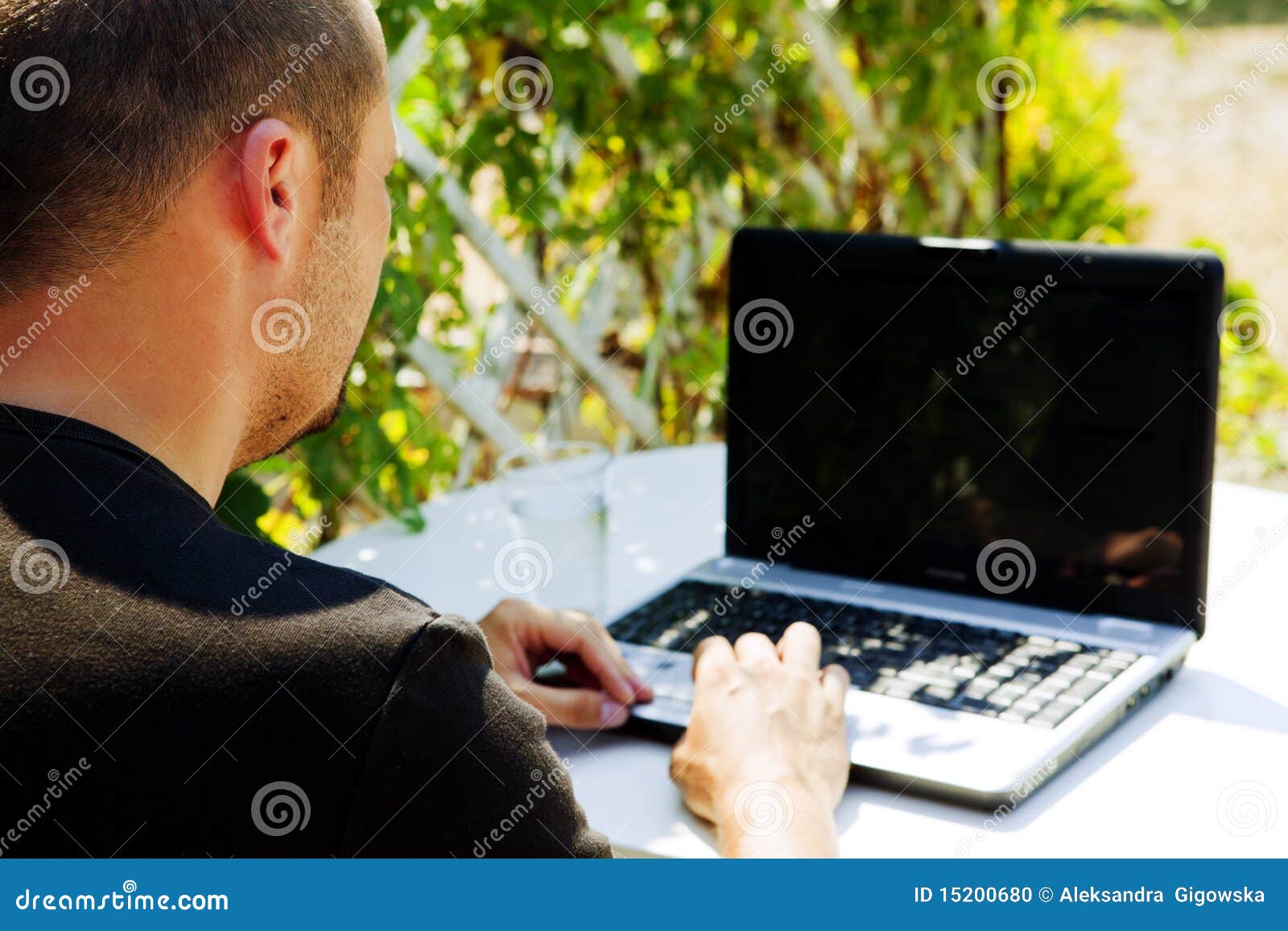 Man Working with Laptop Outside Stock Photo - Image of looking, laptop ...